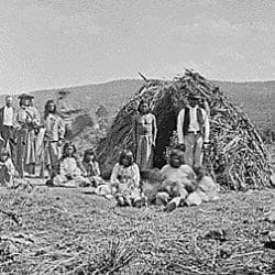 Group of Apaches in front of their wick-8-ups near Camp Apache, Arizona ...